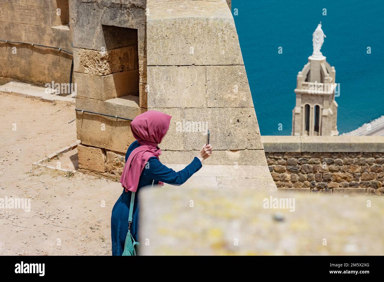 Muslim woman taking photo from the Santa Cruz fortress, one of the ...