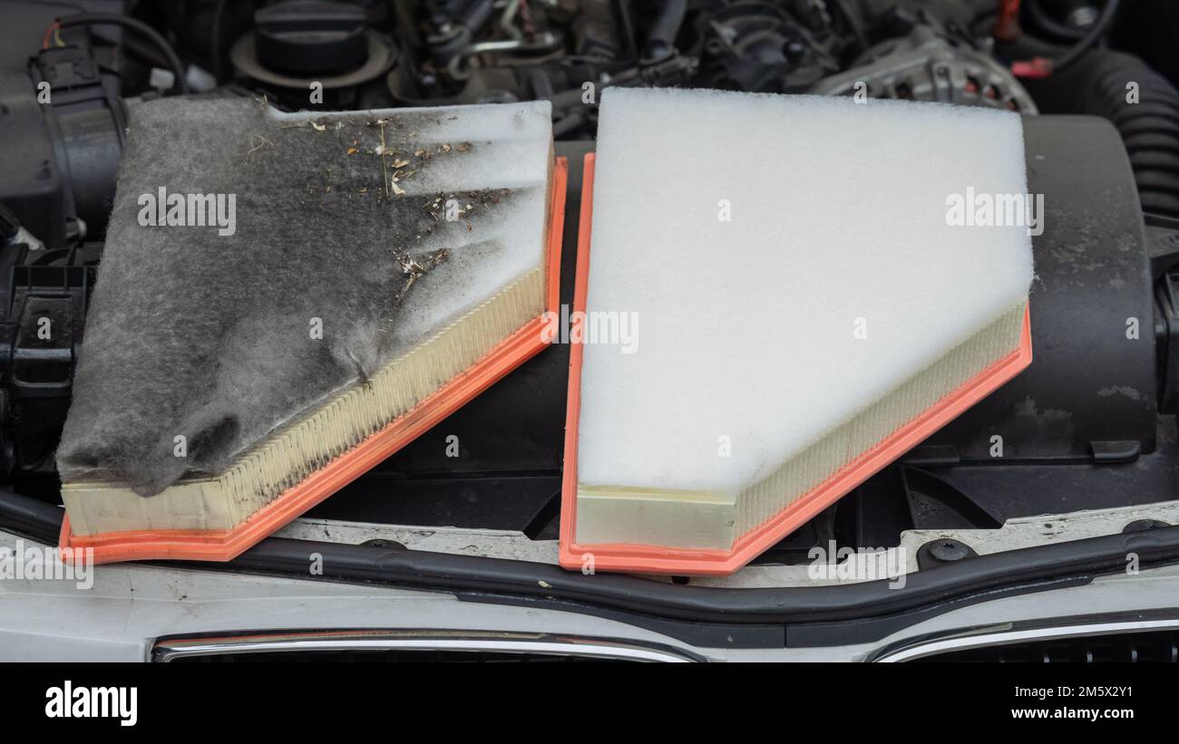 Side by side view of old and new air filter of modern car engine ...