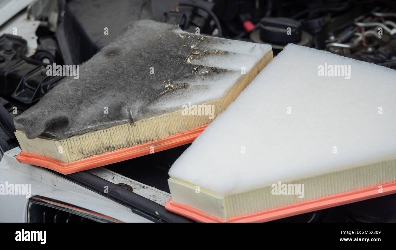 Side by side view of old and new air filter of modern car engine ...