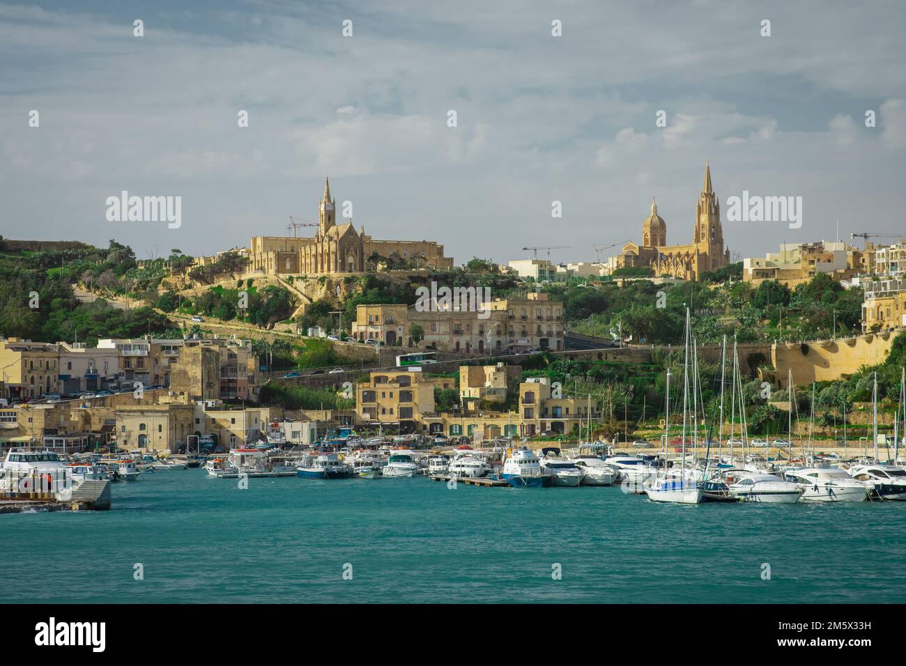 Entrance to the Mgarr port on the island of Gozo with visible marina ...
