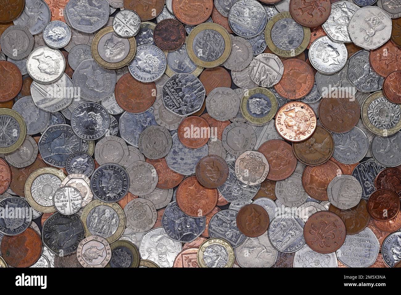 A pile of British coins including 1 pence, 2 pence, 5 pence, 10 pence ...