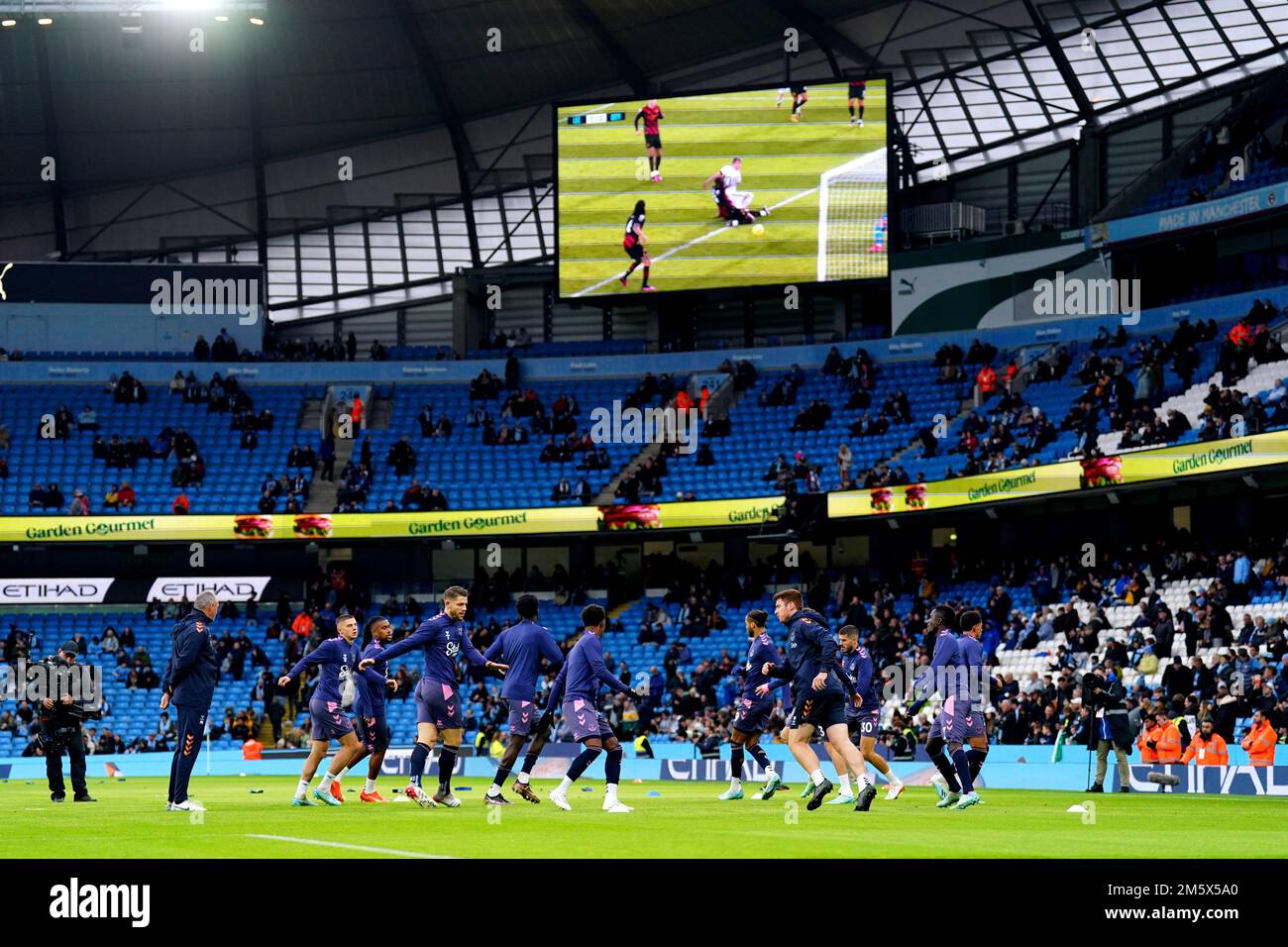 Everton players warm up on the pitch ahead of the Premier League match ...