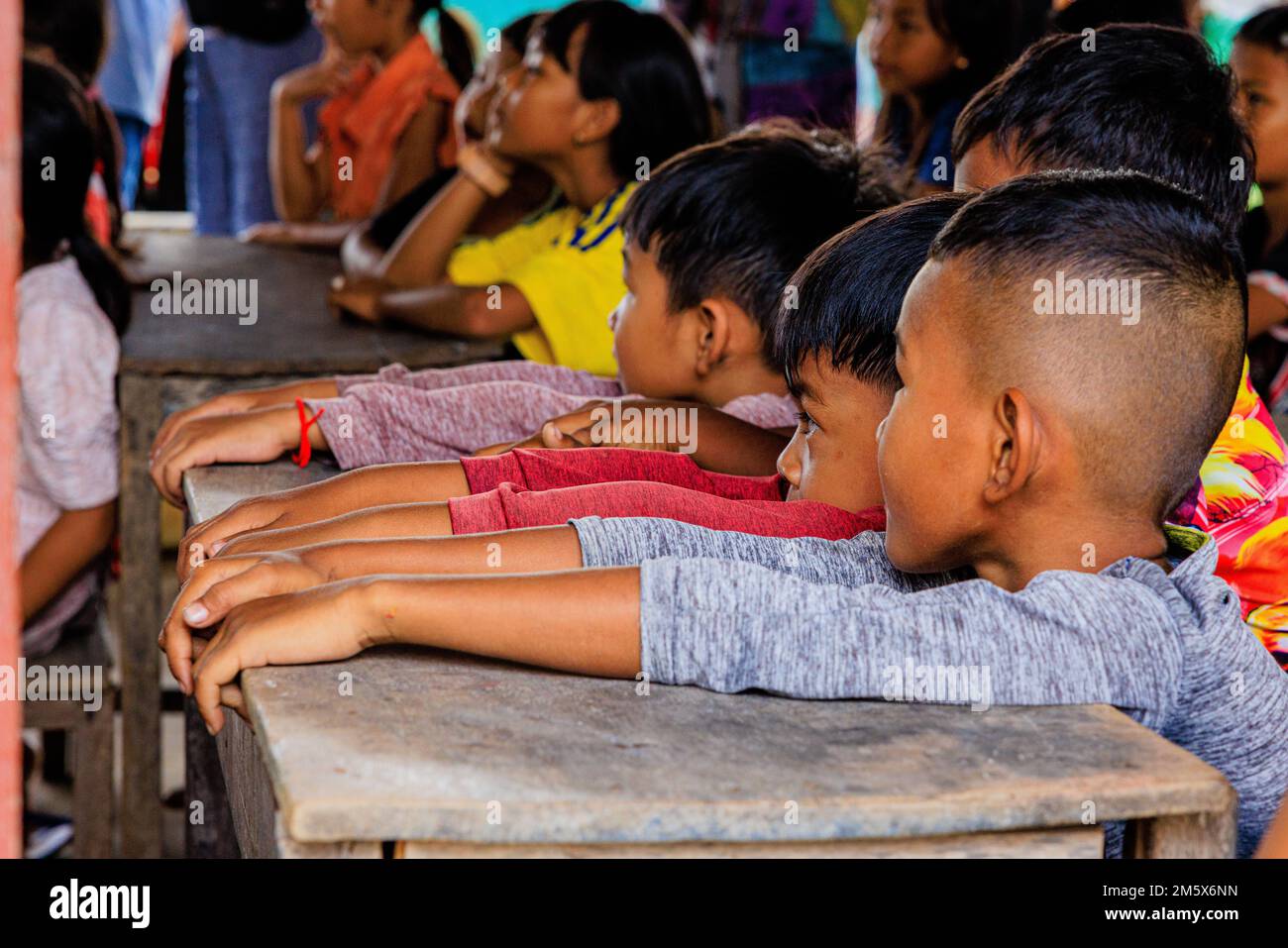 schoolboys at a rural village primary school in cambodia stretch their ...
