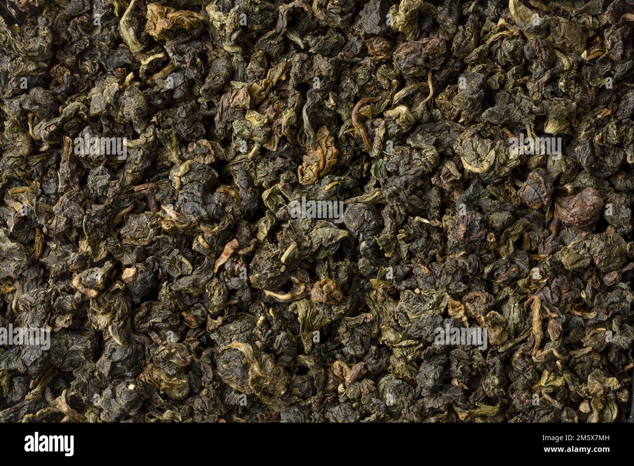 Chinese Ti Kuan Yin organic oolong tea dried tea leaves close up full ...