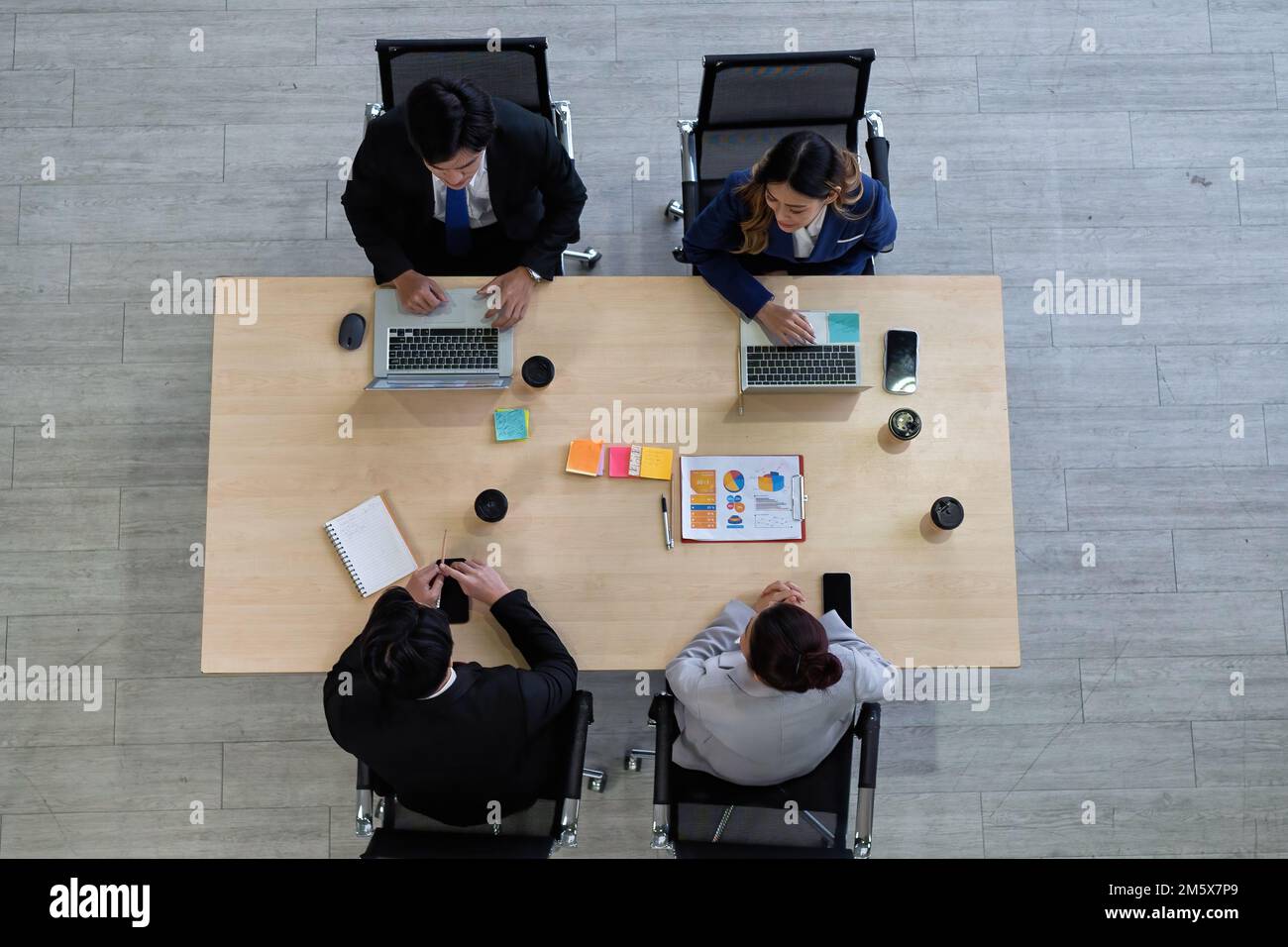 Business meeting top view of business people in formal wear sitting at ...