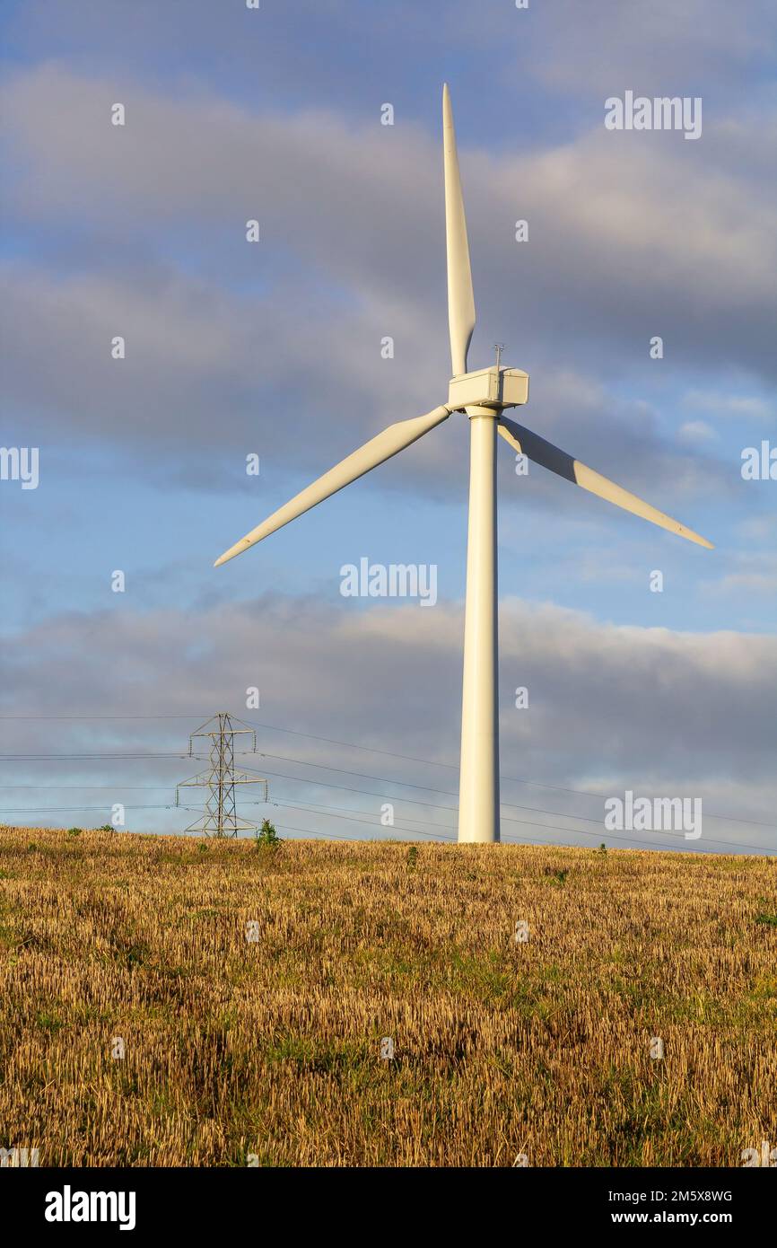 A modern zero emmissions wind turbine located on the road from ...