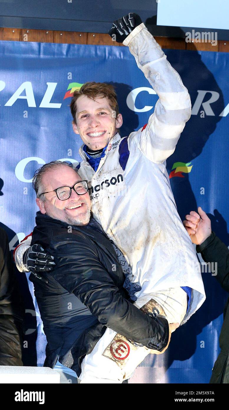 Owner Ged Mason lifts jockey Harry Cobden in the winners enclosure ...