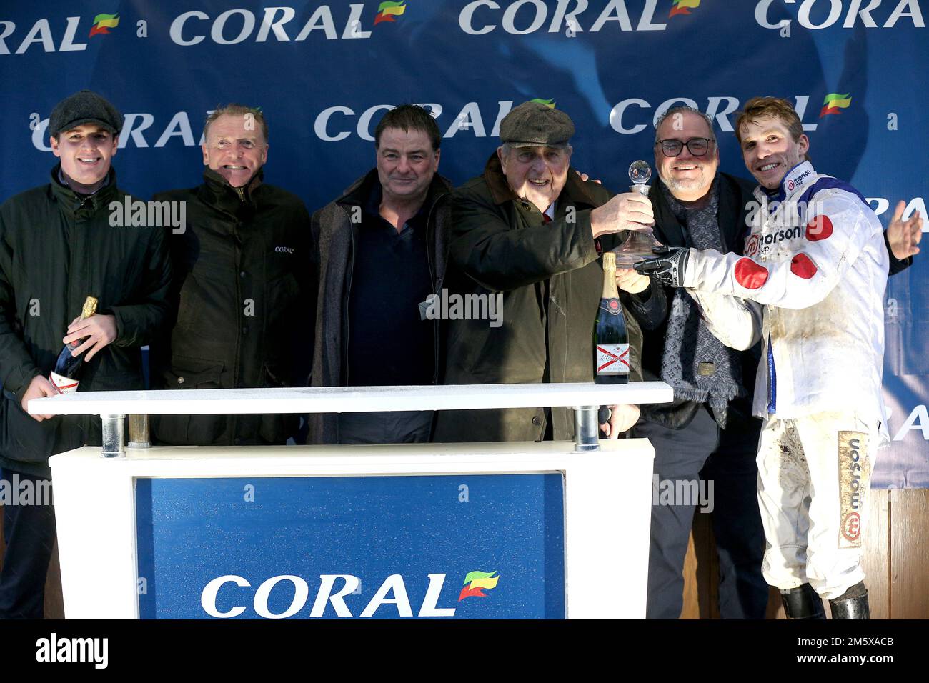 Owner Ged Mason (second right) and jockey Harry Cobden (right) in the ...