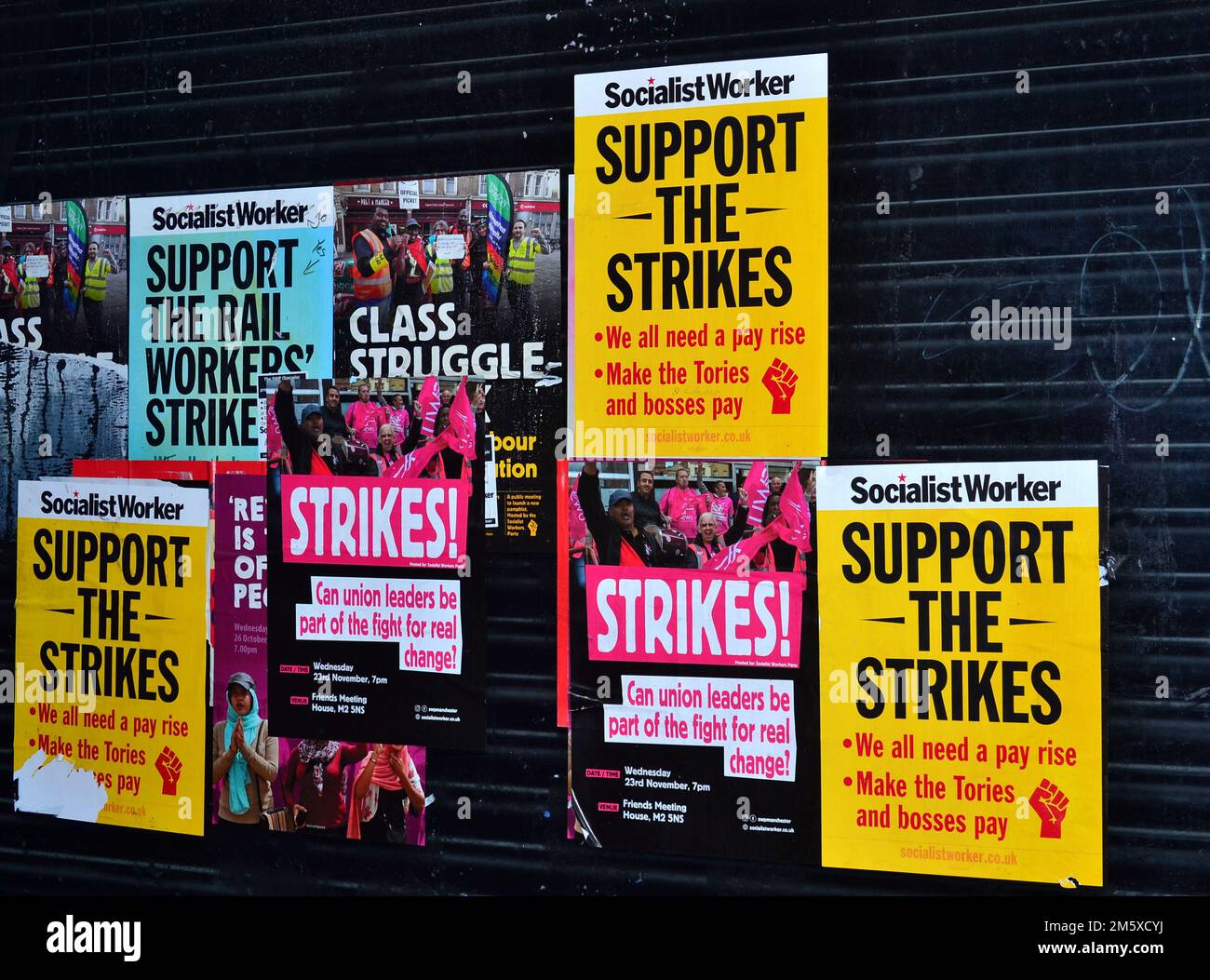 Posters, mainly produced by Socialist Worker, on an empty shop's window ...