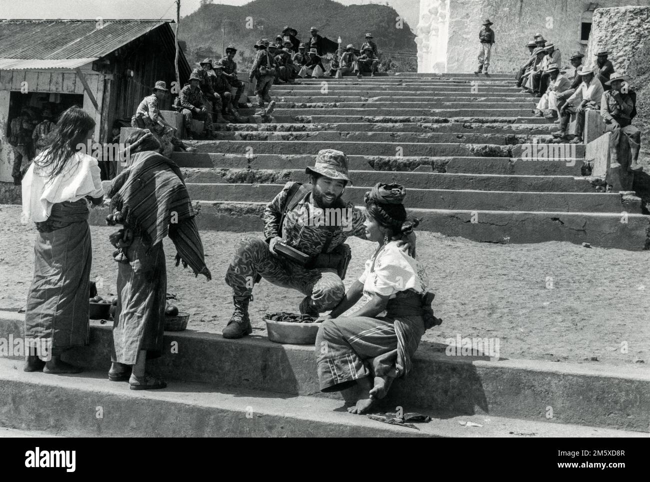 Guatemala, March 1982; A soldier tries to fraternise with girl in ...