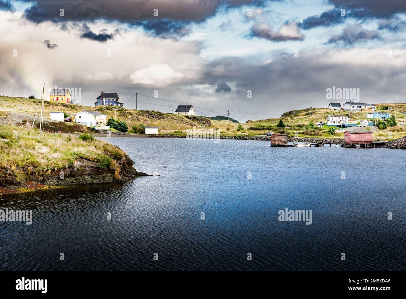 Small rustic colourful beach homes and cottage living on rocky ...