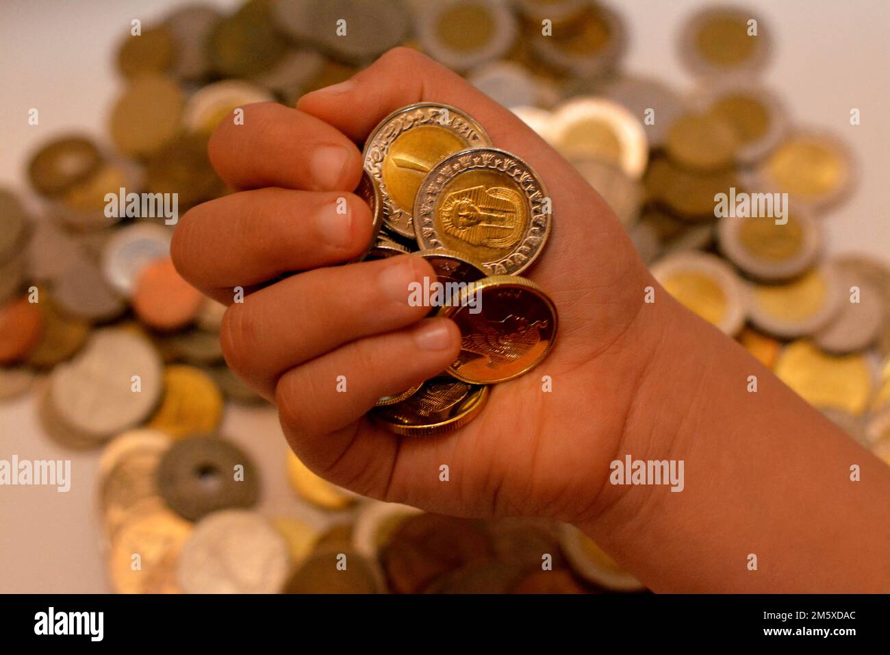 Egyptian child coins hi-res stock photography and images - Alamy