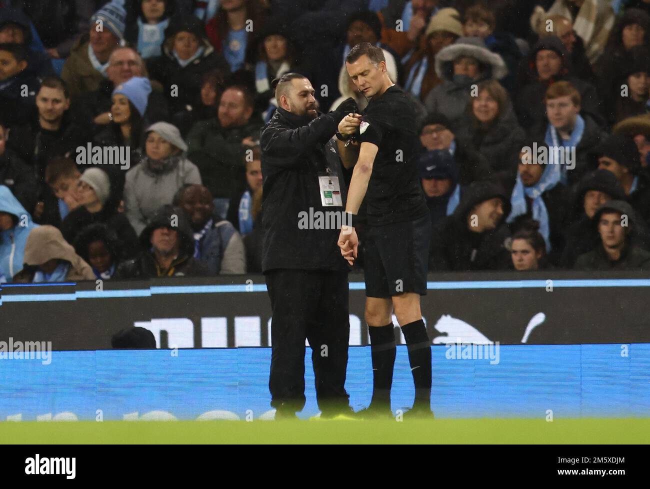 Manchester, UK. 31st Dec, 2022. Referee Andrew Hadley has his ...