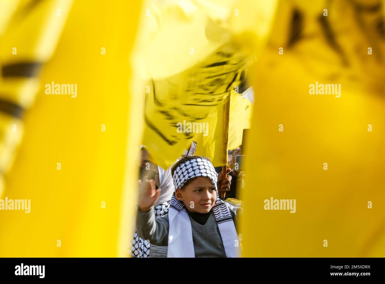 Palestinian boy takes part in Fatah movement rally marking the 58th ...