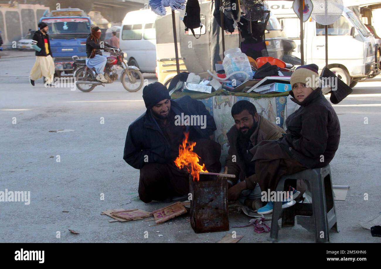 People warm their hands on bone-fire to save themselves from cold waves ...