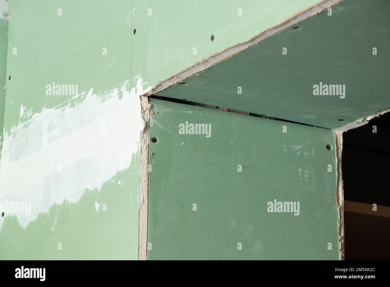 green plasterboard wall in a room during renovation, renovation of an ...