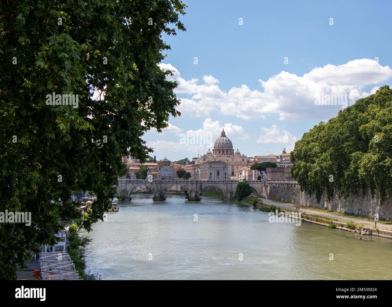 The beautiful view of St. Peter's Basilica with the river crossing the ...