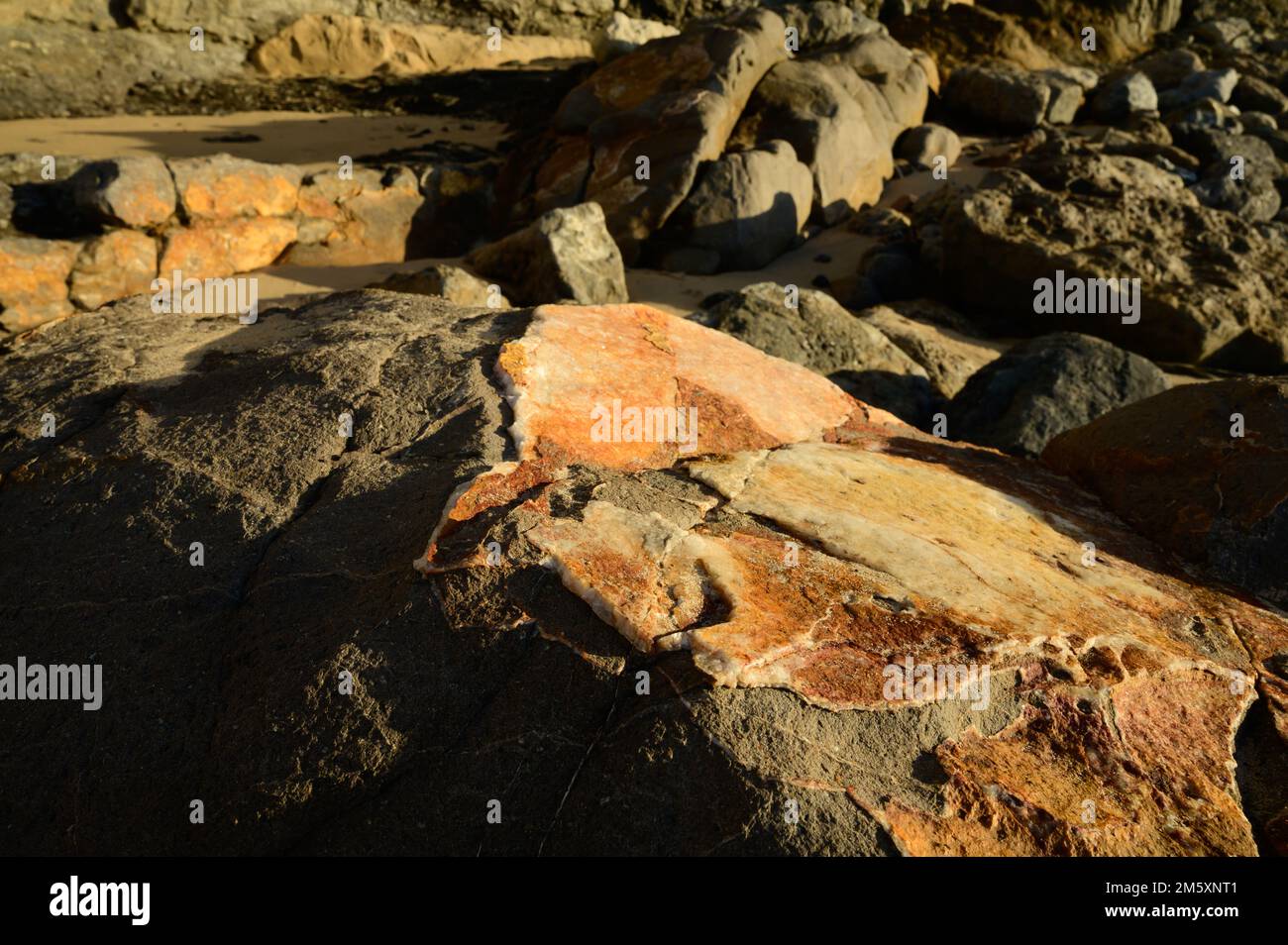 Geological formation of colorful stones with different layers, yellow ...