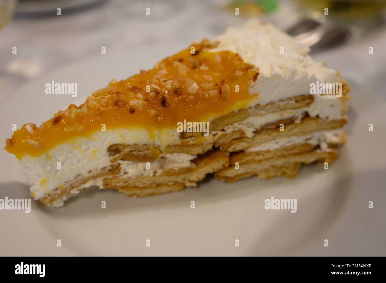 Traditional Portuguese cake with cream, fruits and cookies close up ...