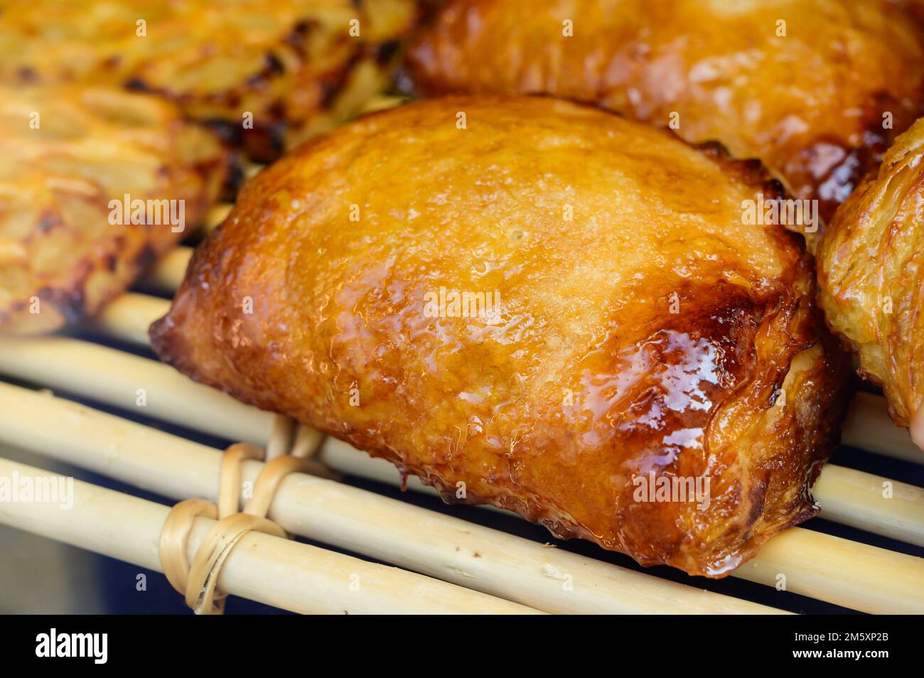 French bakery, fresh baked sweet buns and rolls on display in small ...
