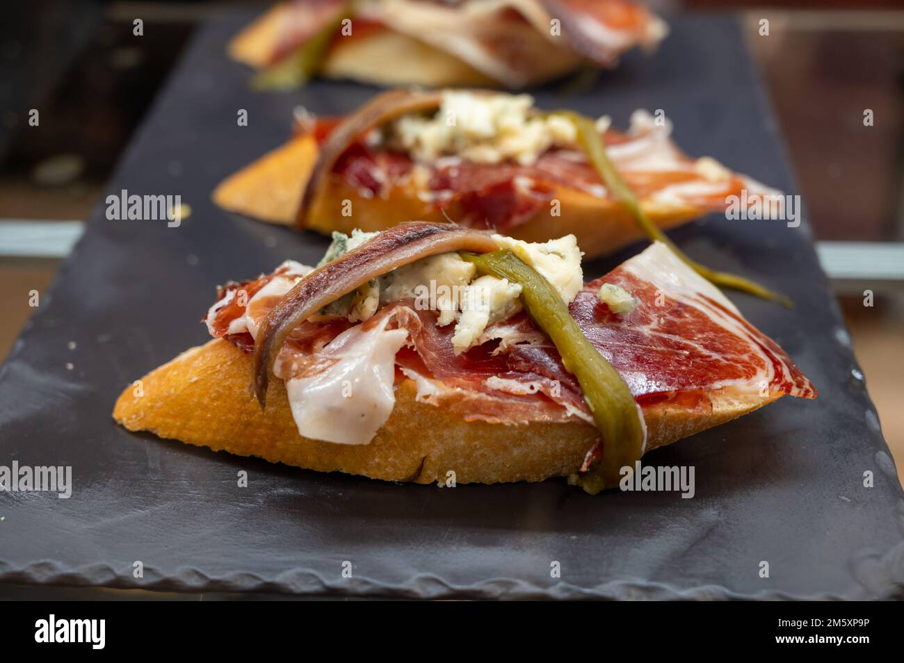 Typical snack of Basque Country, pinchos or pinxtos, small piece of ...