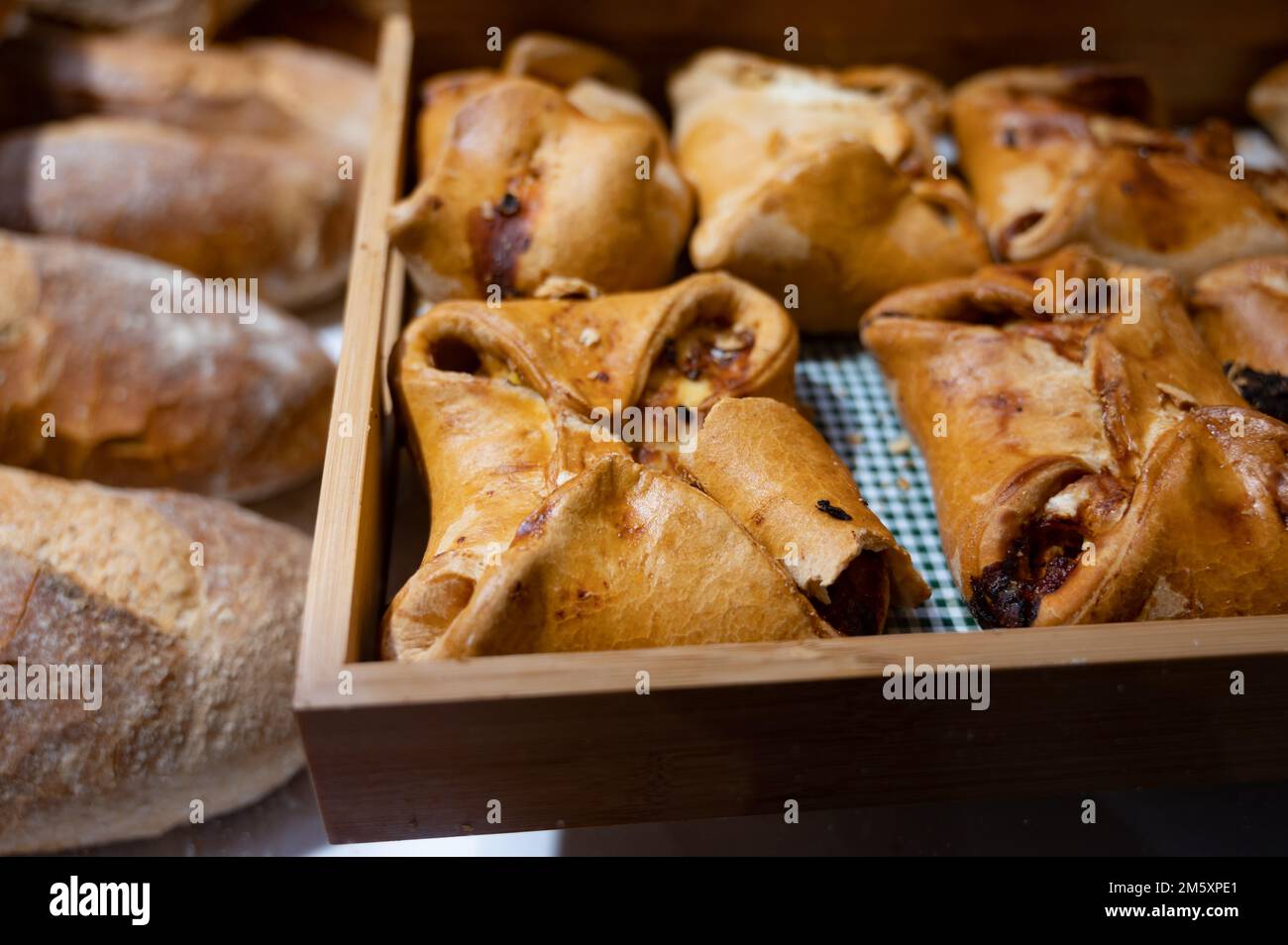 Spanish snacks and street food, baked pie empanadilla with different ...