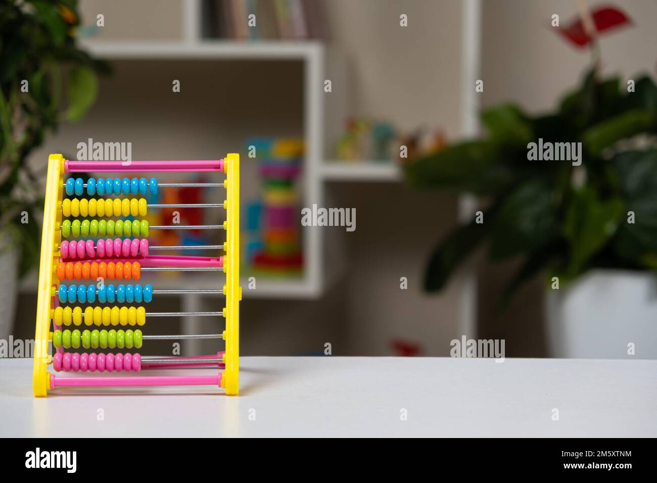 Colorful children's abacus on the table. Mathematics, arithmetic for ...