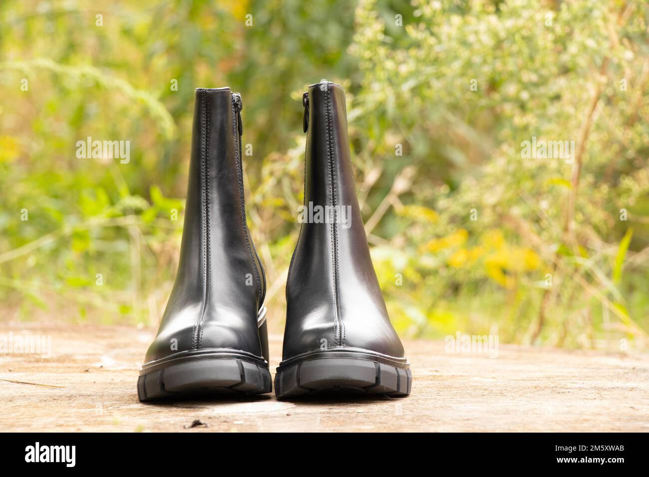 womens high black boots with thick soles stand on logs, womens shoes ...