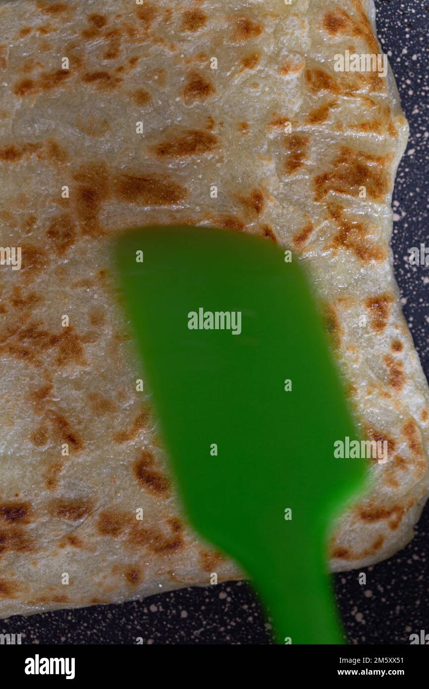 Moroccan Msemen flaky bread in the pan Stock Photo - Alamy