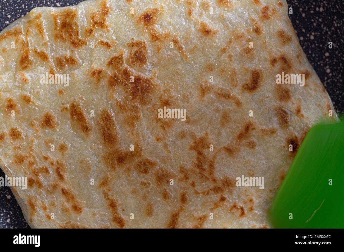 Moroccan Msemen flaky bread in the pan Stock Photo - Alamy