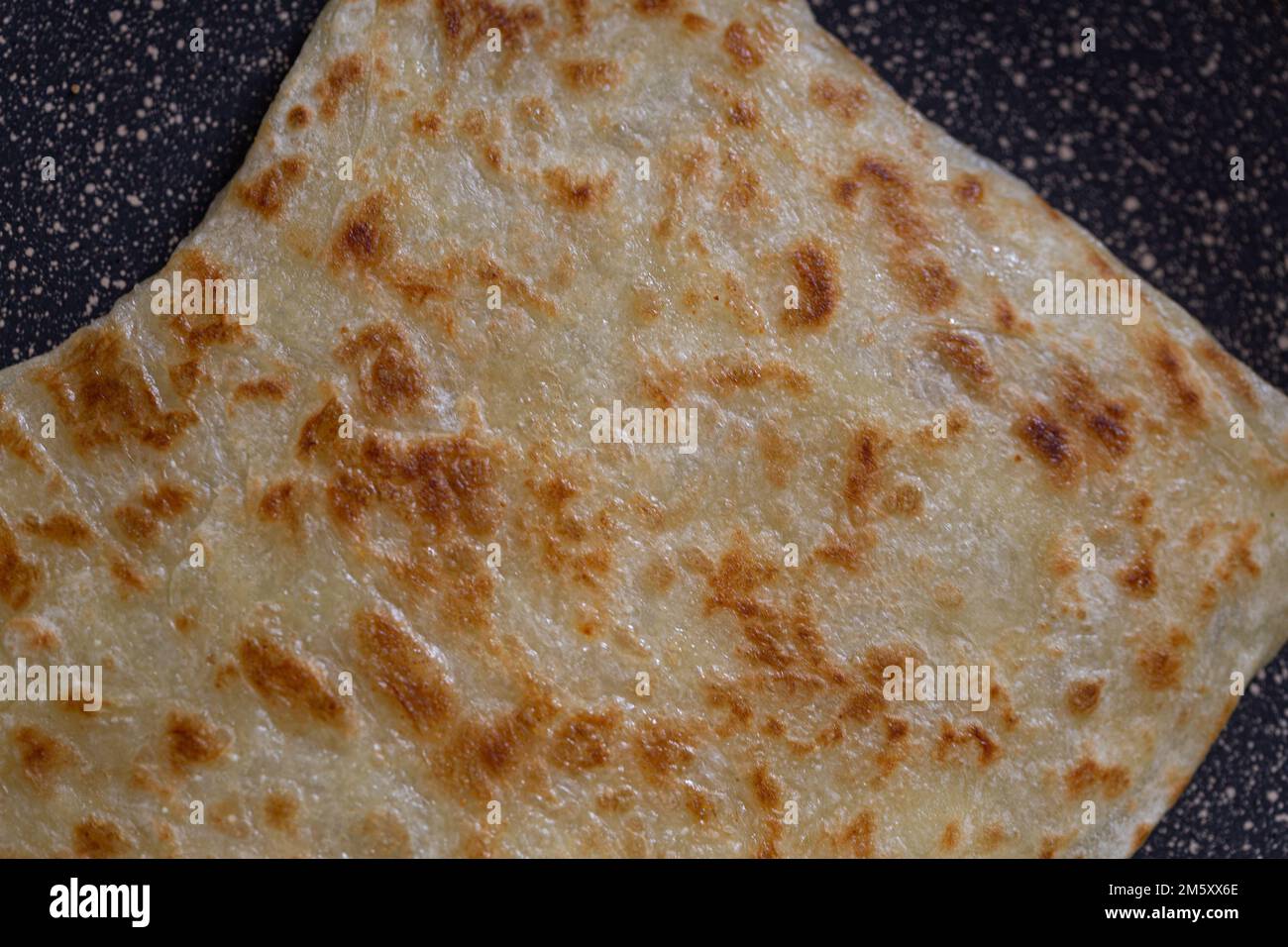 Moroccan Msemen flaky bread in the pan Stock Photo - Alamy
