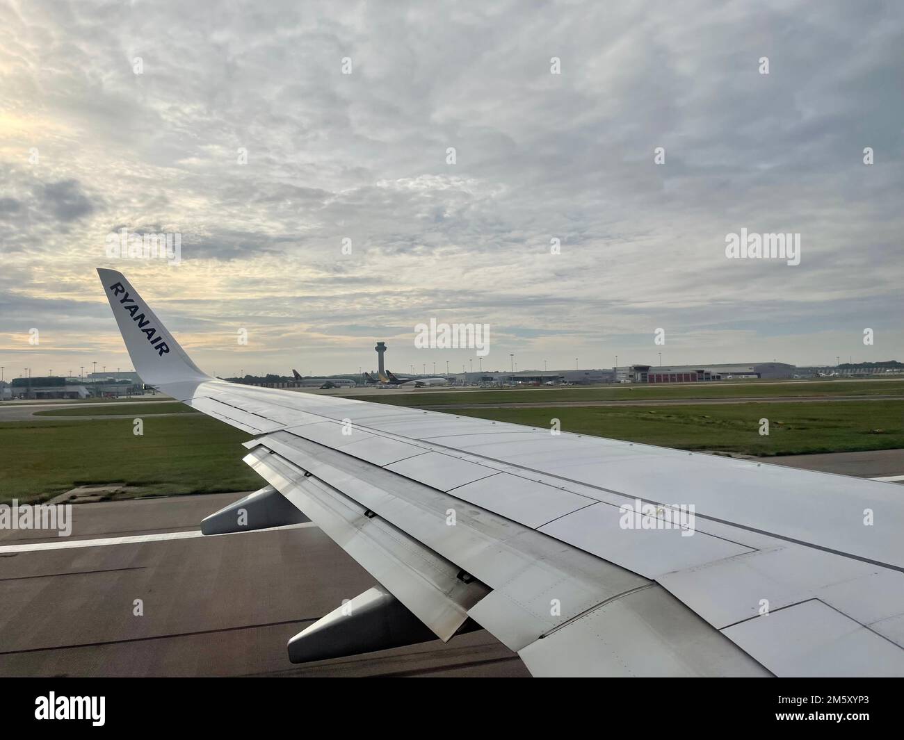 Wing of Boeing 737 MAX on the runway ready for departure at London ...