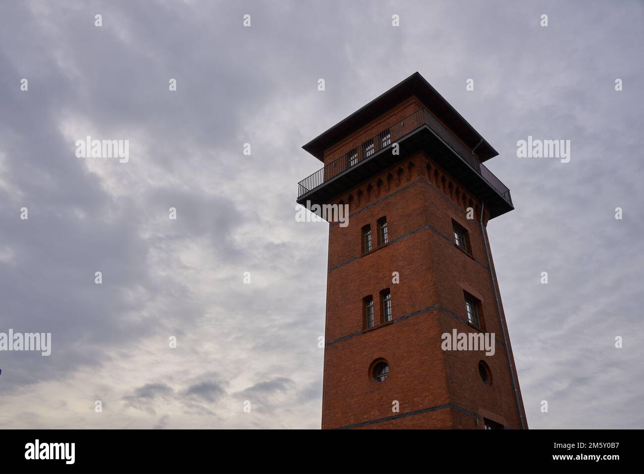 A low angle of a brick tower on a cloudy background Stock Photo - Alamy