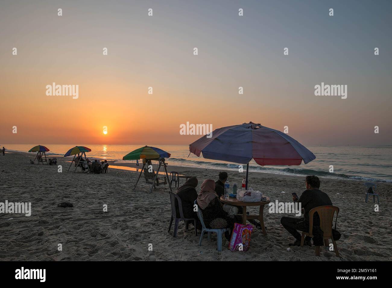 Palestinians enjoy in the beach of Gaza city during the last sunset of ...