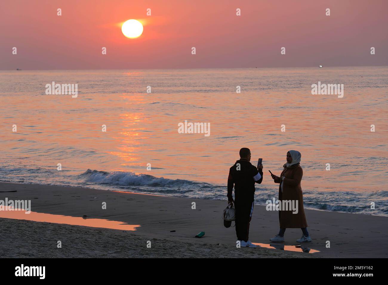 Palestinians enjoy in the beach of Gaza city during the last sunset of ...
