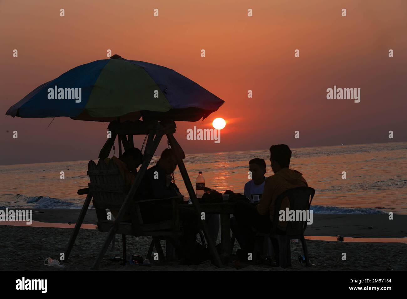 Palestinians enjoy in the beach of Gaza city during the last sunset of ...