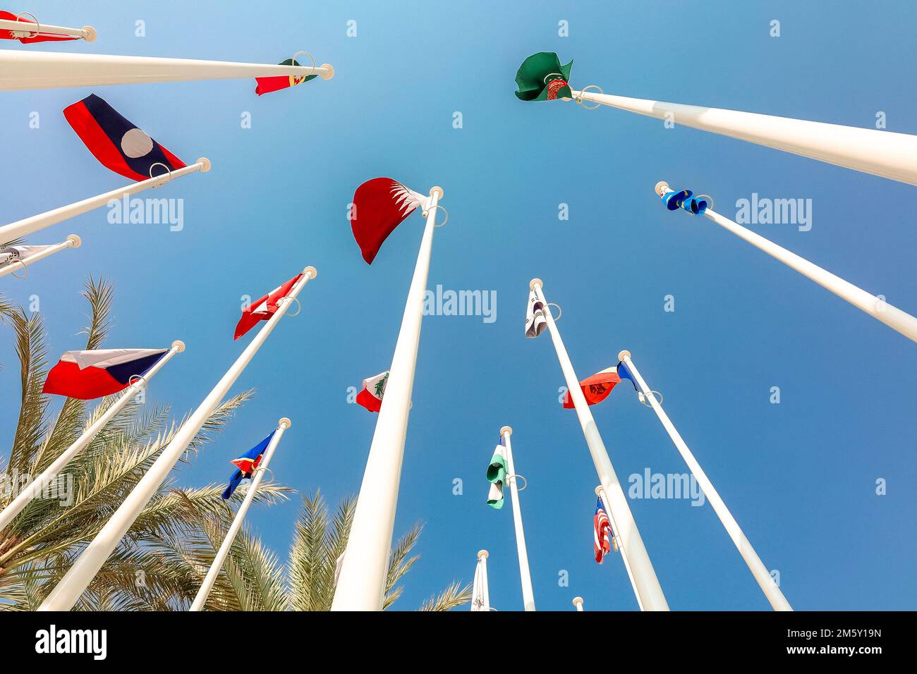 Flags of different countries of world flutters in wind background of ...
