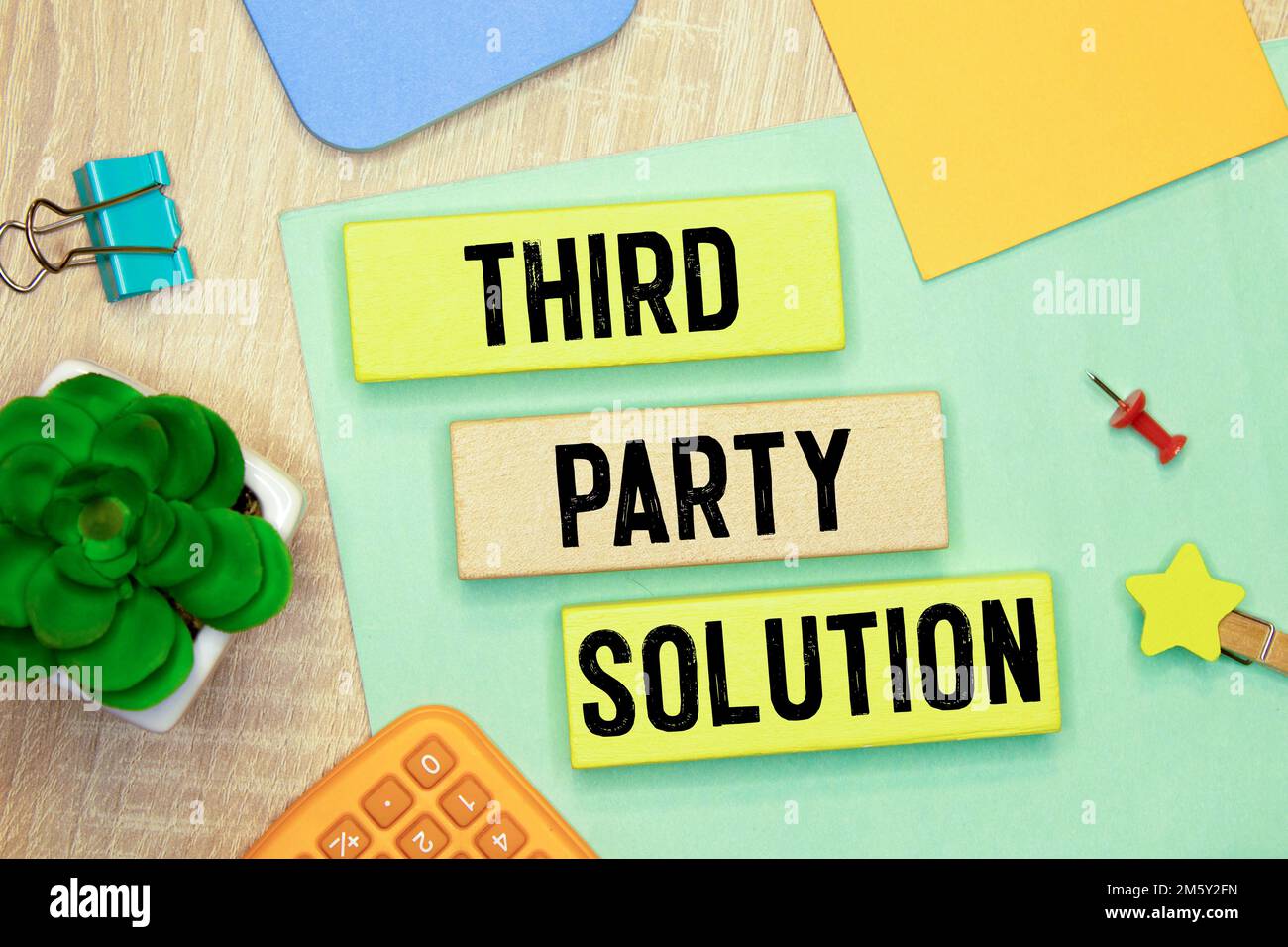 Closeup on businessman holding a card with THIRD PARTY SOLUTION message ...