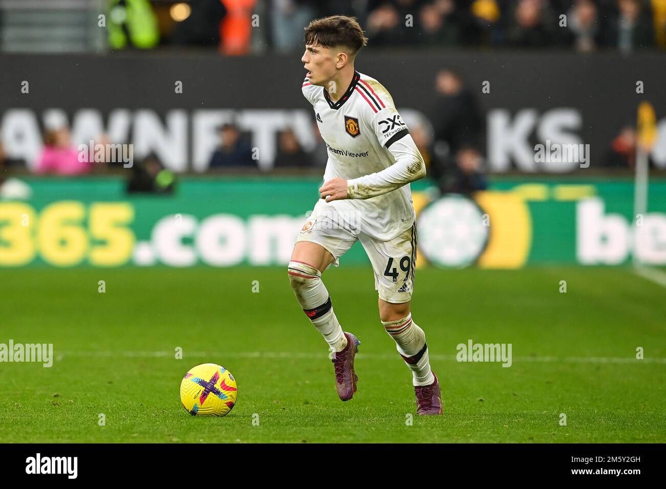 Alejandro Garnacho #49 of Manchester United makes a break with the ball ...