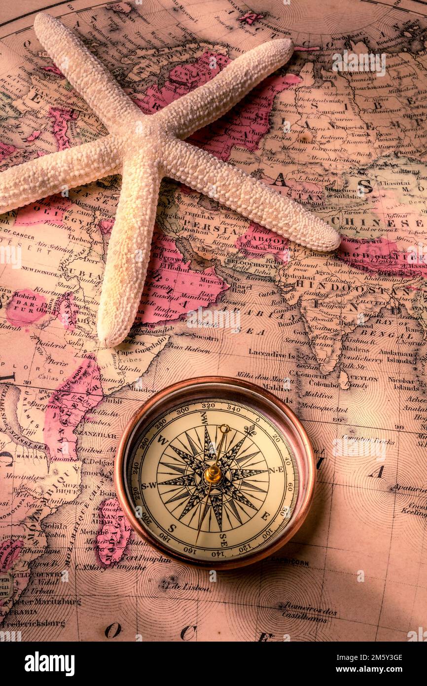 Map maps compass compasses still life hi-res stock photography and ...