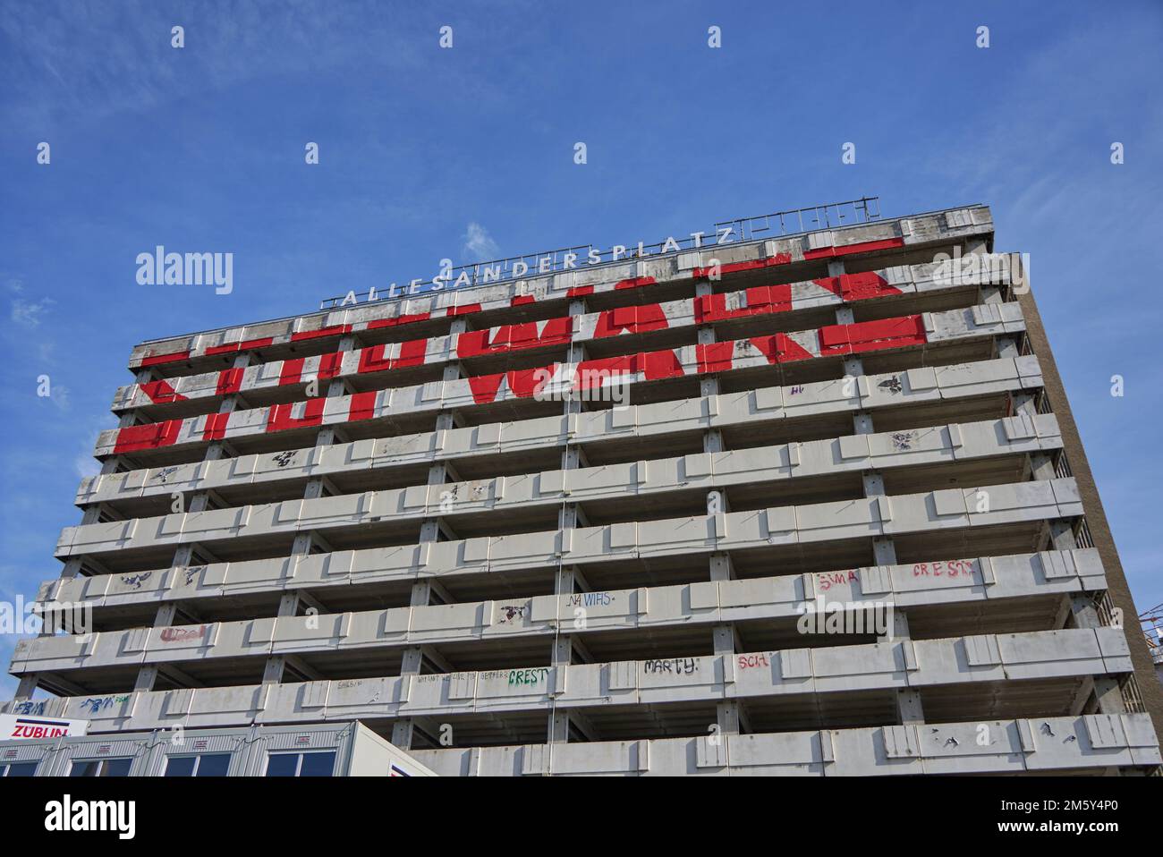 A closeup shot of modern unique buildings in Berlin, Germany with blue ...