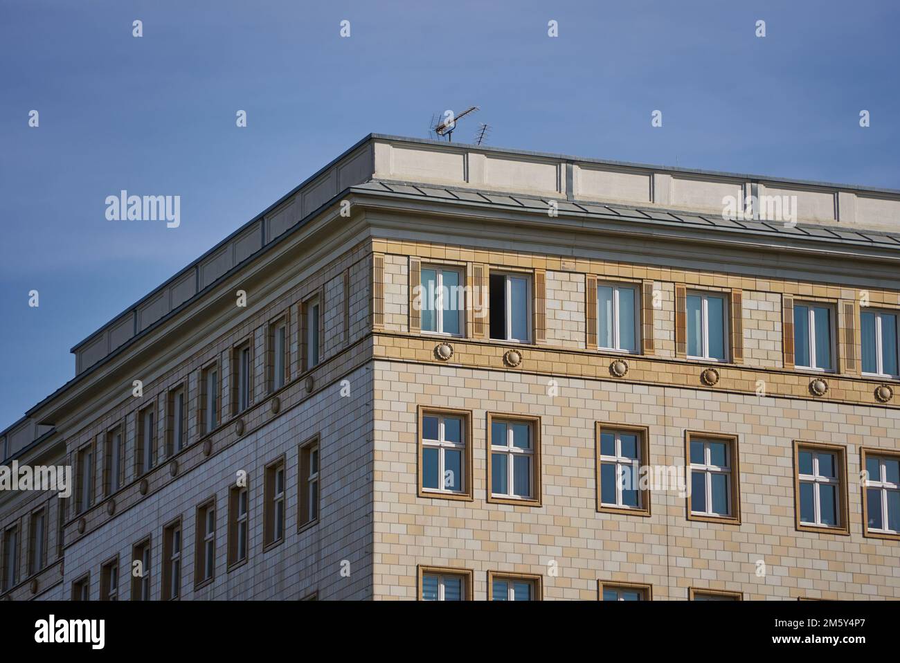 A closeup shot of modern unique buildings in Berlin, Germany with blue ...