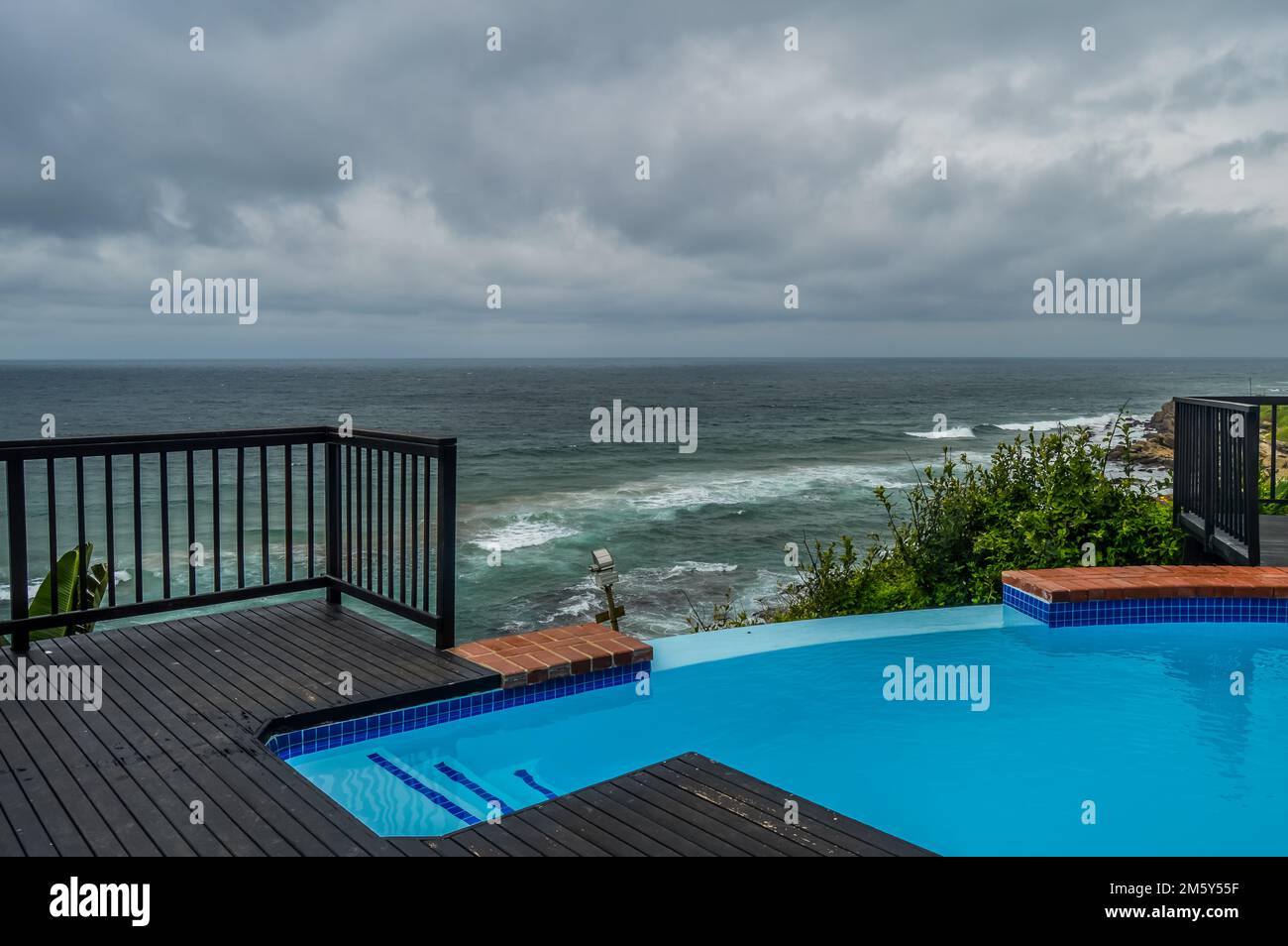 Outdoor jacuzzi and luxurious spa bath and infinity pool along Atlantic ...