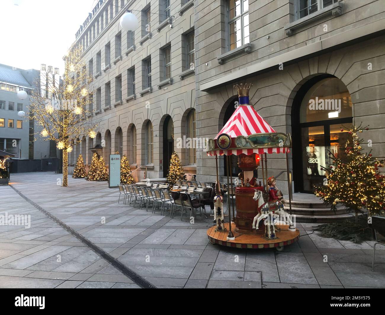 The festive Christmas decorations and a mini Merry go round carousel in ...