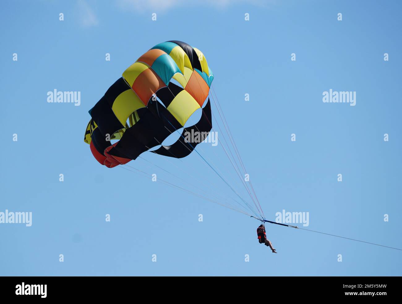 A distance view of a colorful parachute on the sky near Mazatlan ...