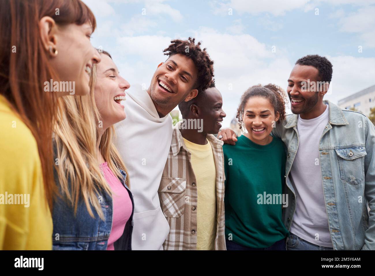 Happy Young people walking and laughing. Cheerful Group of mixed race ...