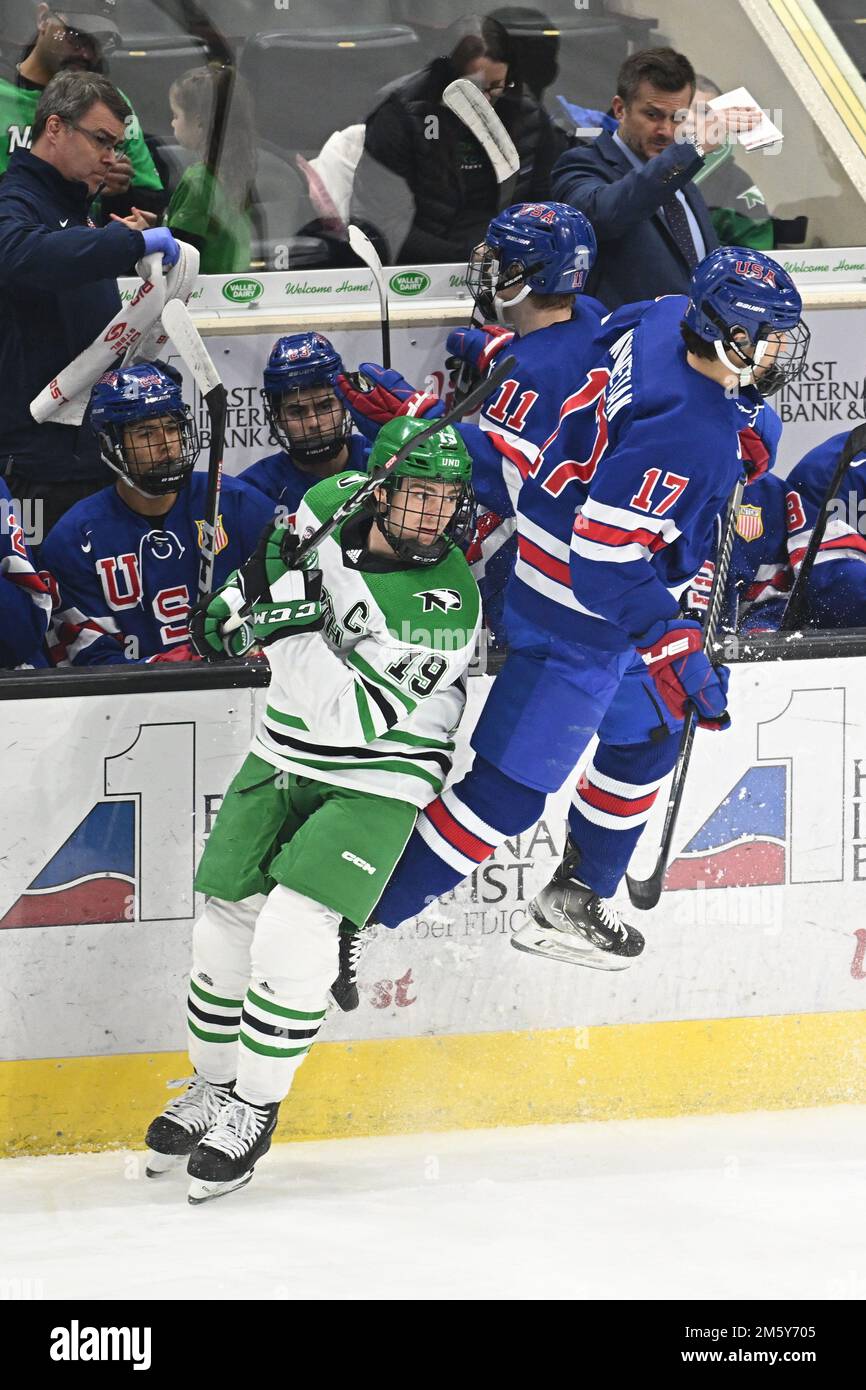 North Dakota Fighting Hawks forward Mark Senden (19) checks US National ...