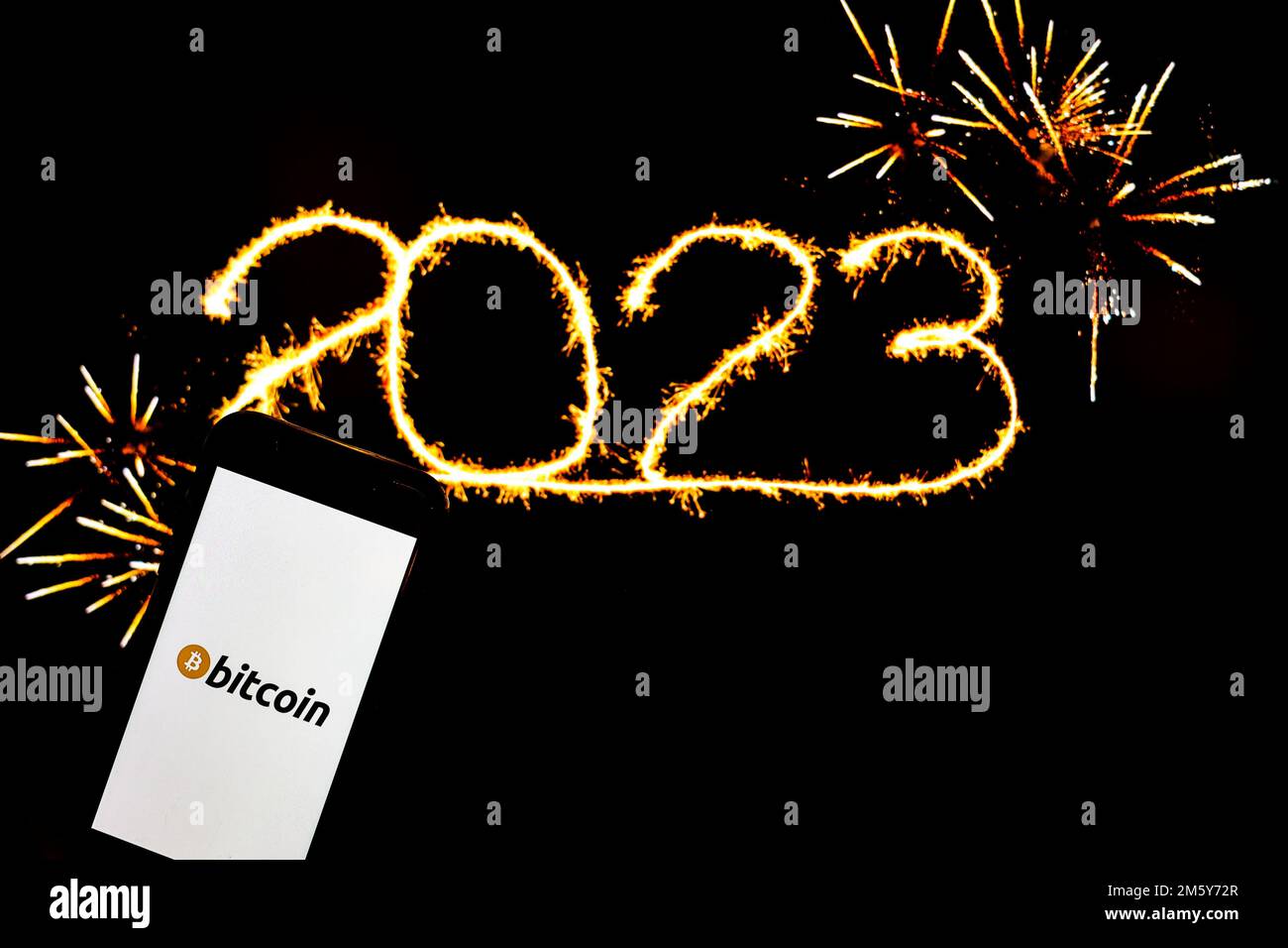 Poland. 31st Dec, 2022. In this photo illustration a Bitcoin logo seen ...
