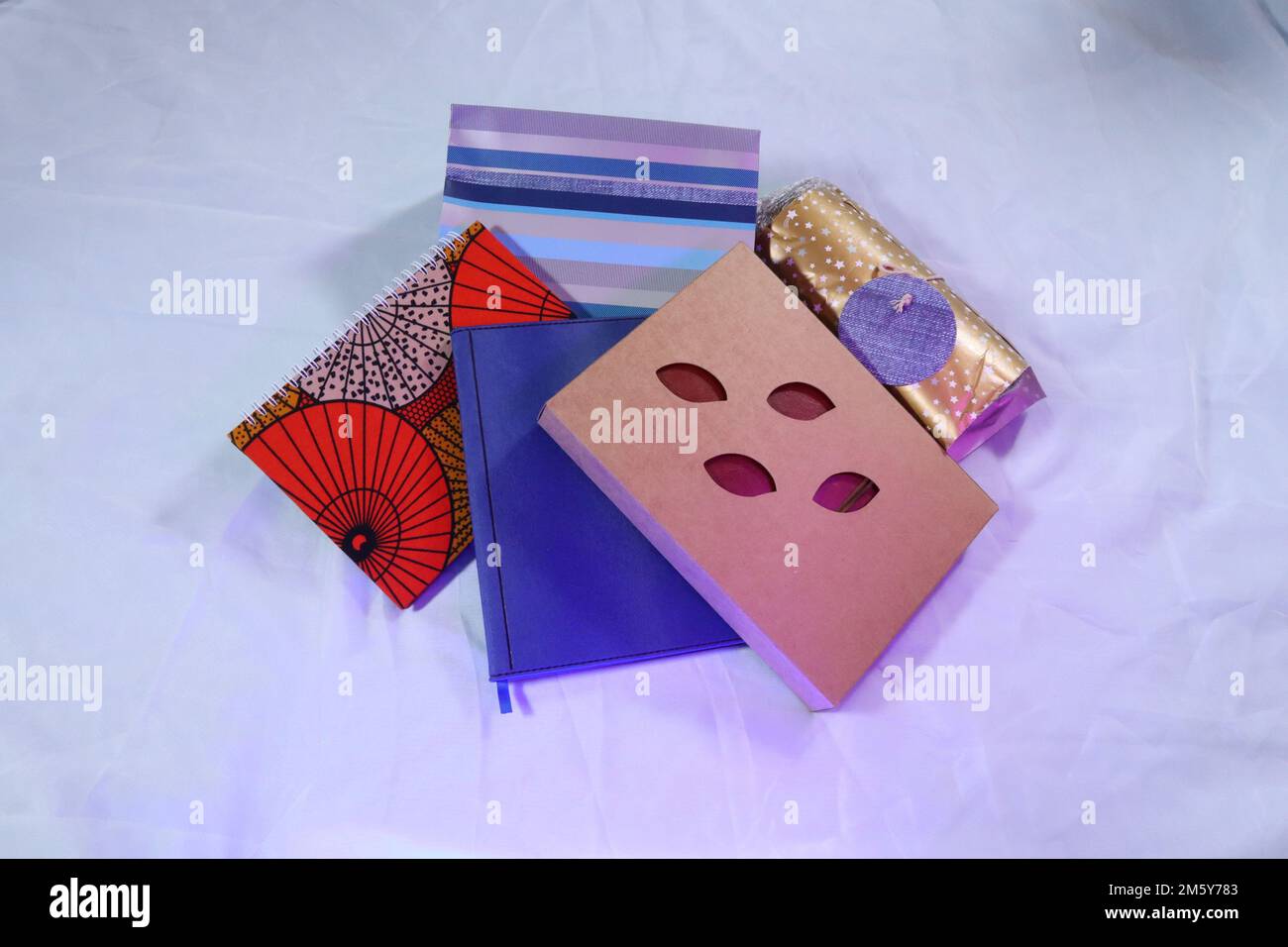 The colorful notebooks on white background Stock Photo - Alamy