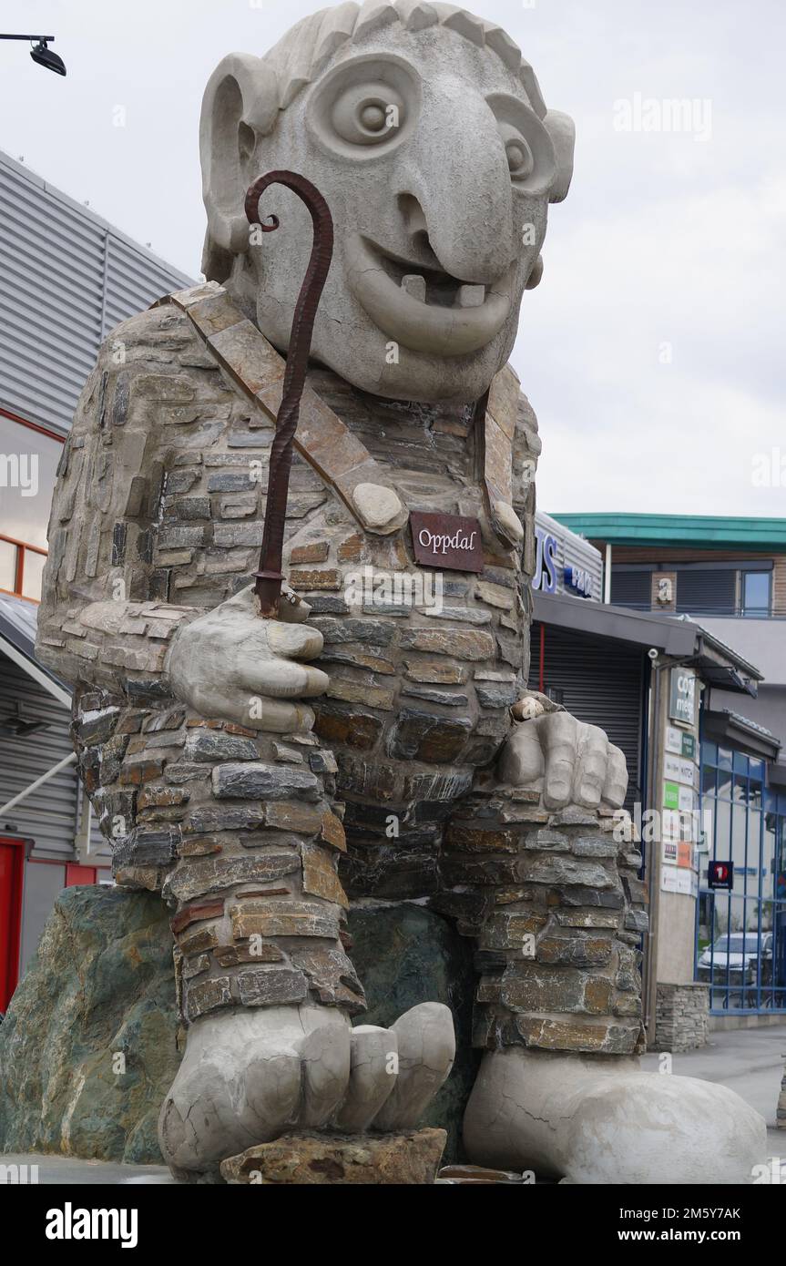 A vertical shot of a statue in front of the Coop Mega shopping center ...